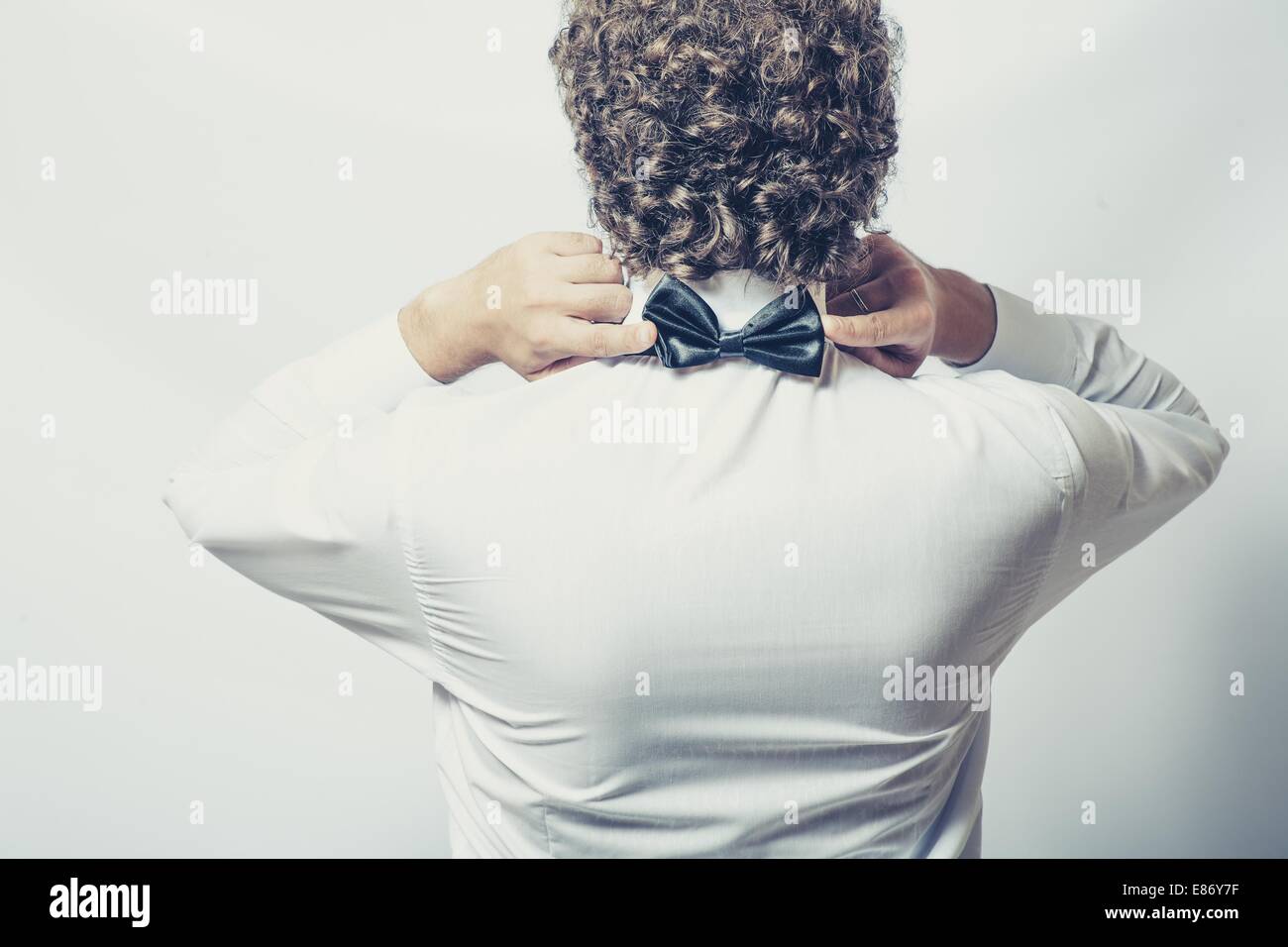 Bow tie on the back side. Strange or fun concept. Back view of an ...