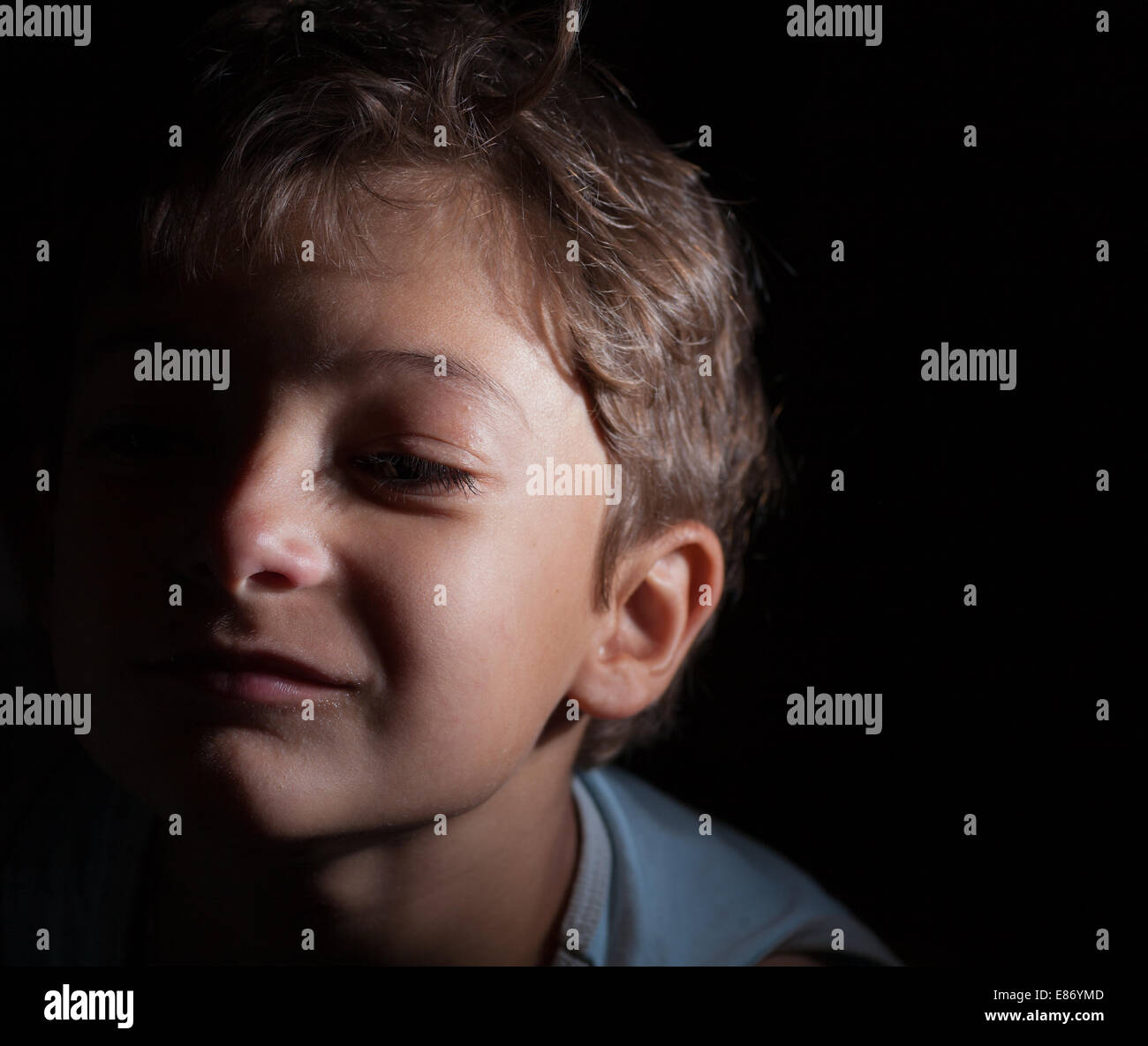 Very sad boy in the dark hi-res stock photography and images - Alamy