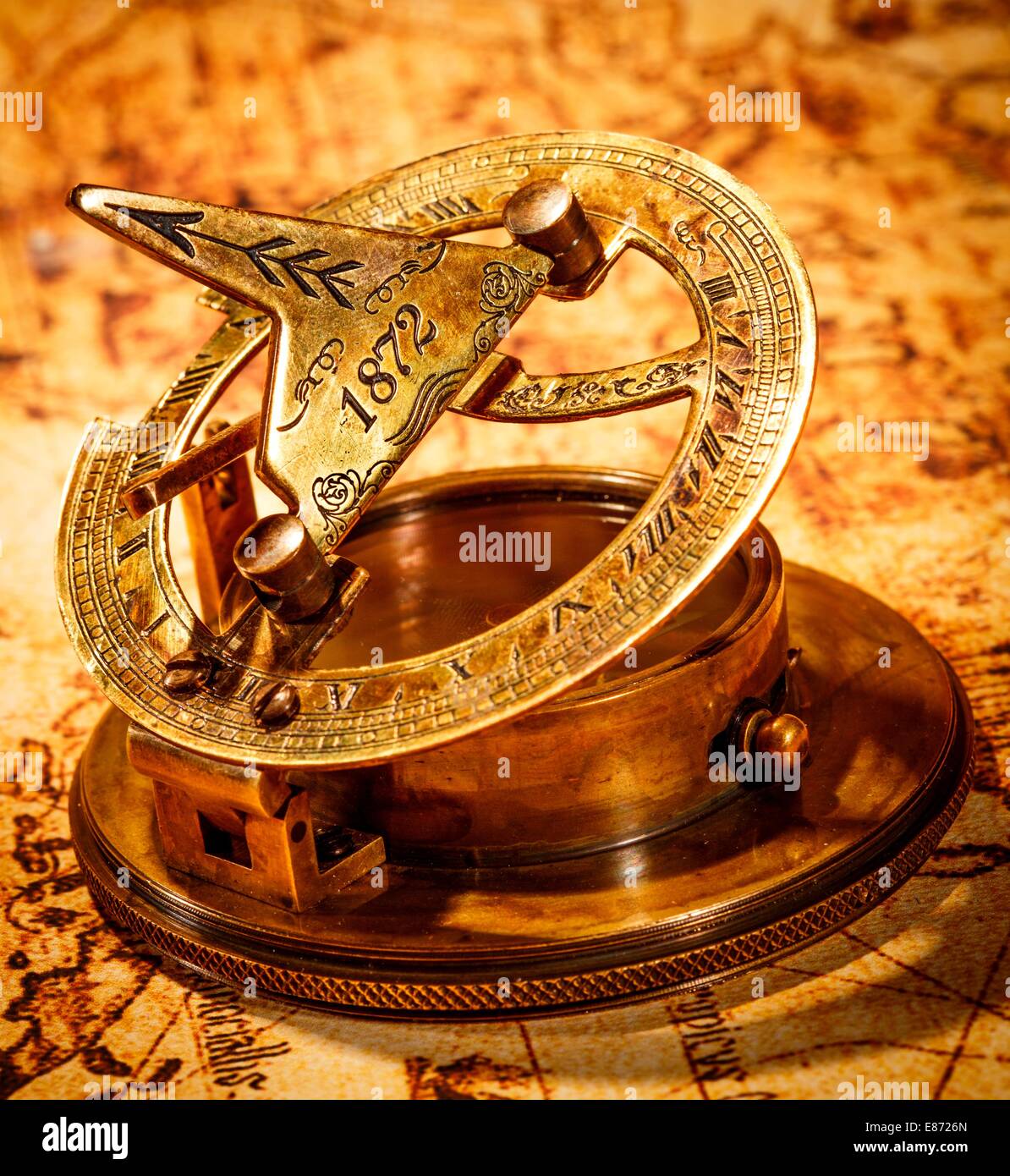 Vintage still life. Vintage compass lies on an ancient world map Stock ...