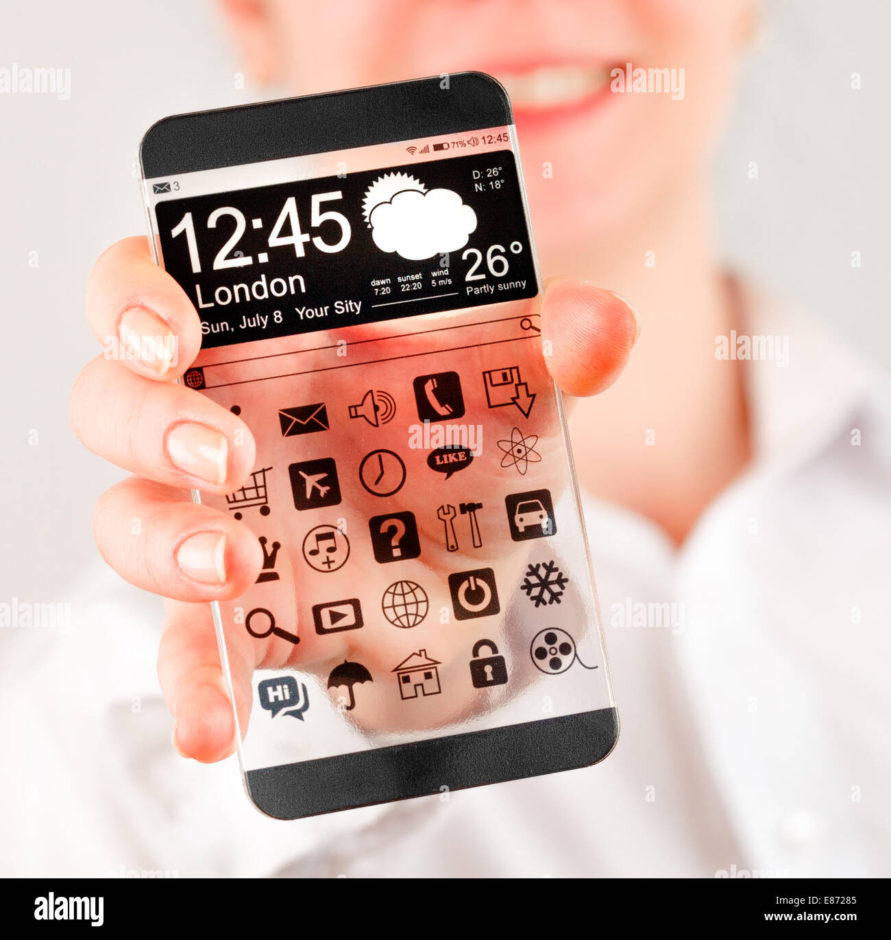 Smartphone (phablet) with a transparent display in human hands. Concept ...