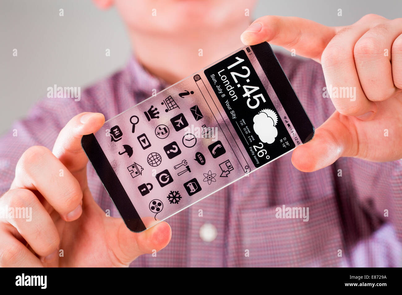 Smartphone (phablet) with a transparent display in human hands. Concept ...