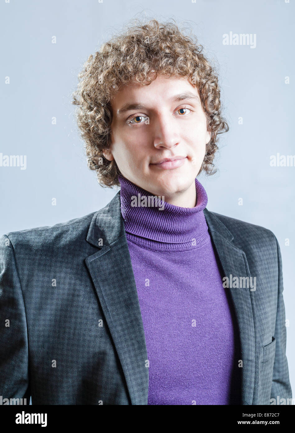 Front view of a young caucasian guy with curly hair Stock Photo - Alamy