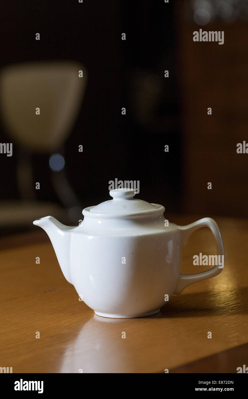 white teapot on table Stock Photo - Alamy