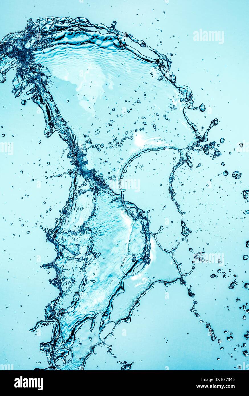 Abstract water splash on blue background Stock Photo - Alamy