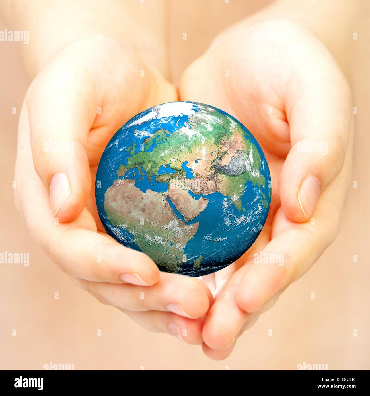 Human hand holding a globe Stock Photo - Alamy