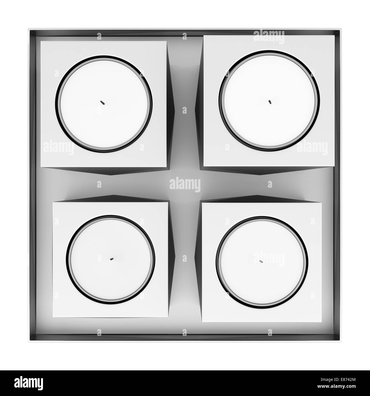 top view of four metallic candlesticks with candles isolated on white ...