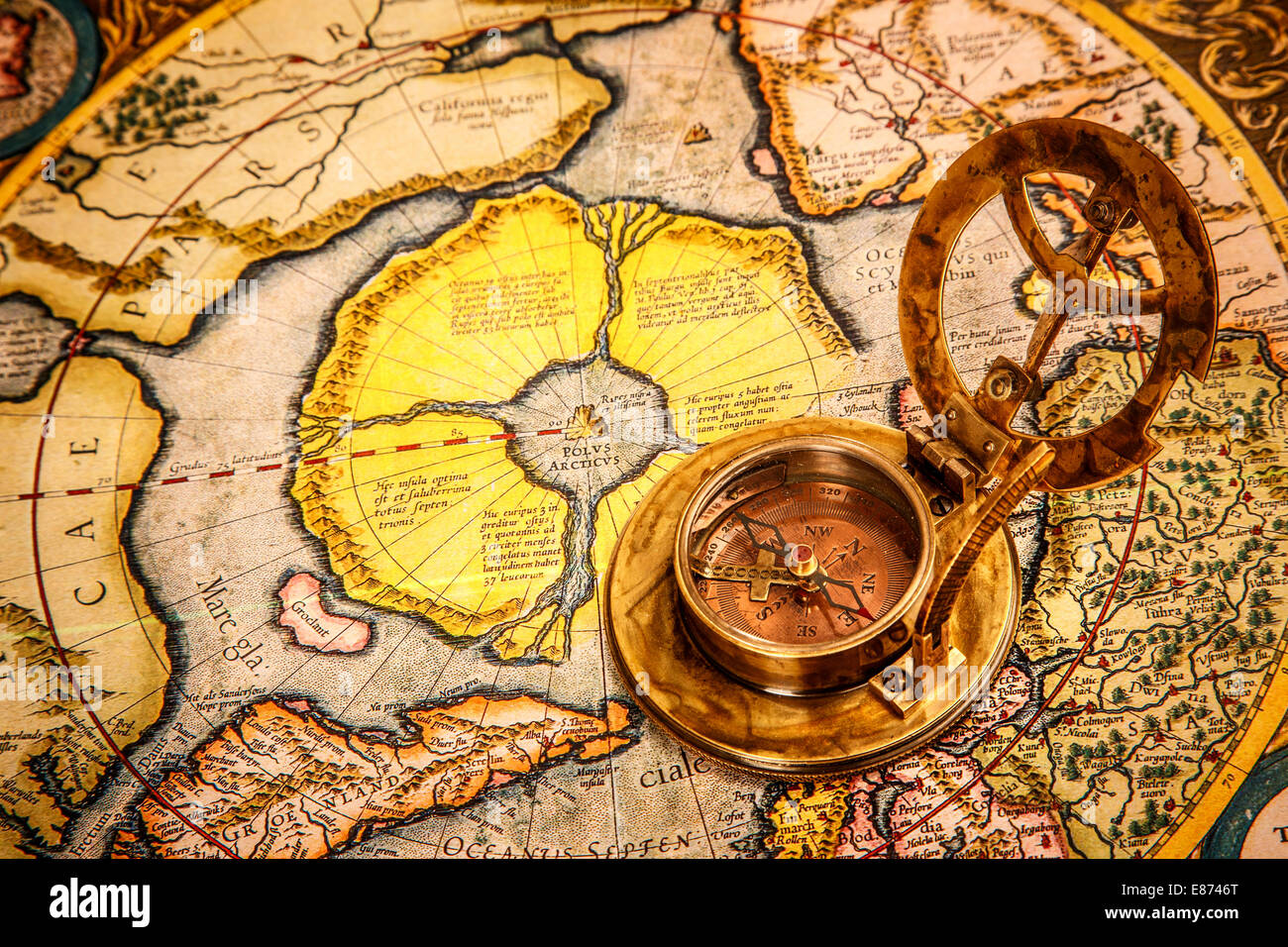 Vintage still life. Vintage compass lies on on the ancient map of the ...