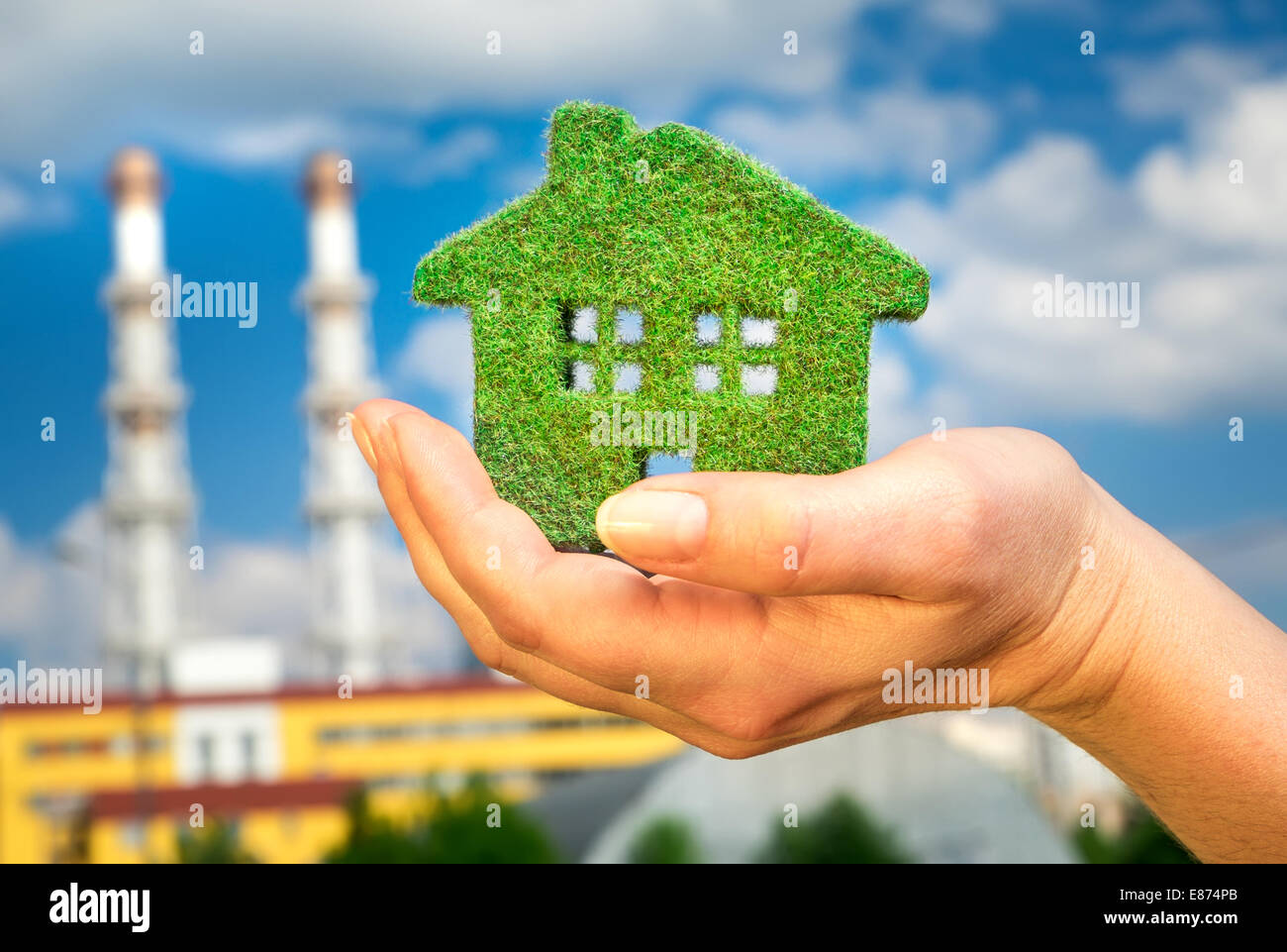 Grass home on a background of blue sky in human hands Stock Photo - Alamy