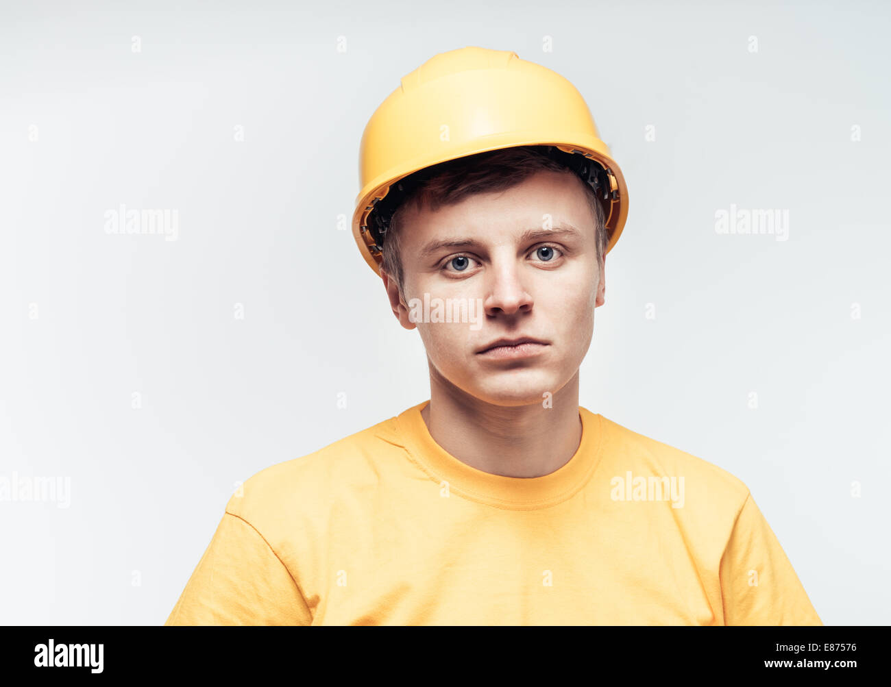 Worker in yellow helmet Stock Photo - Alamy