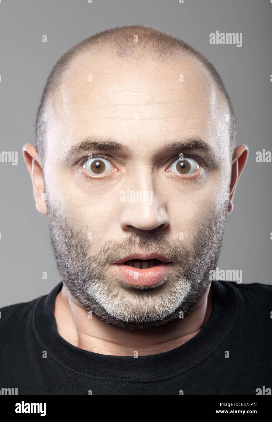 scared man portrait isolated on gray background Stock Photo - Alamy