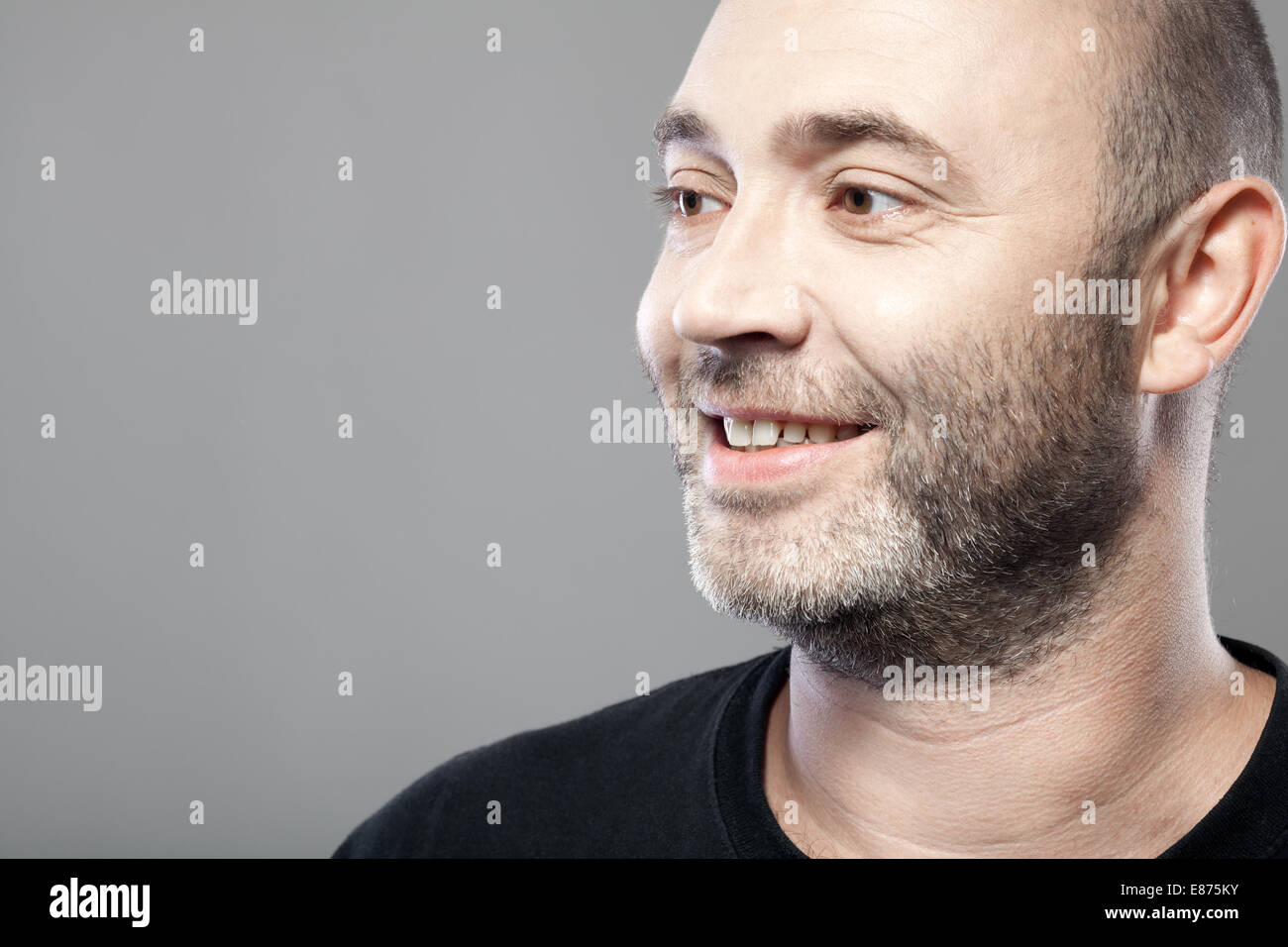 portrait of smiling man isolated on gray background with copyspace ...