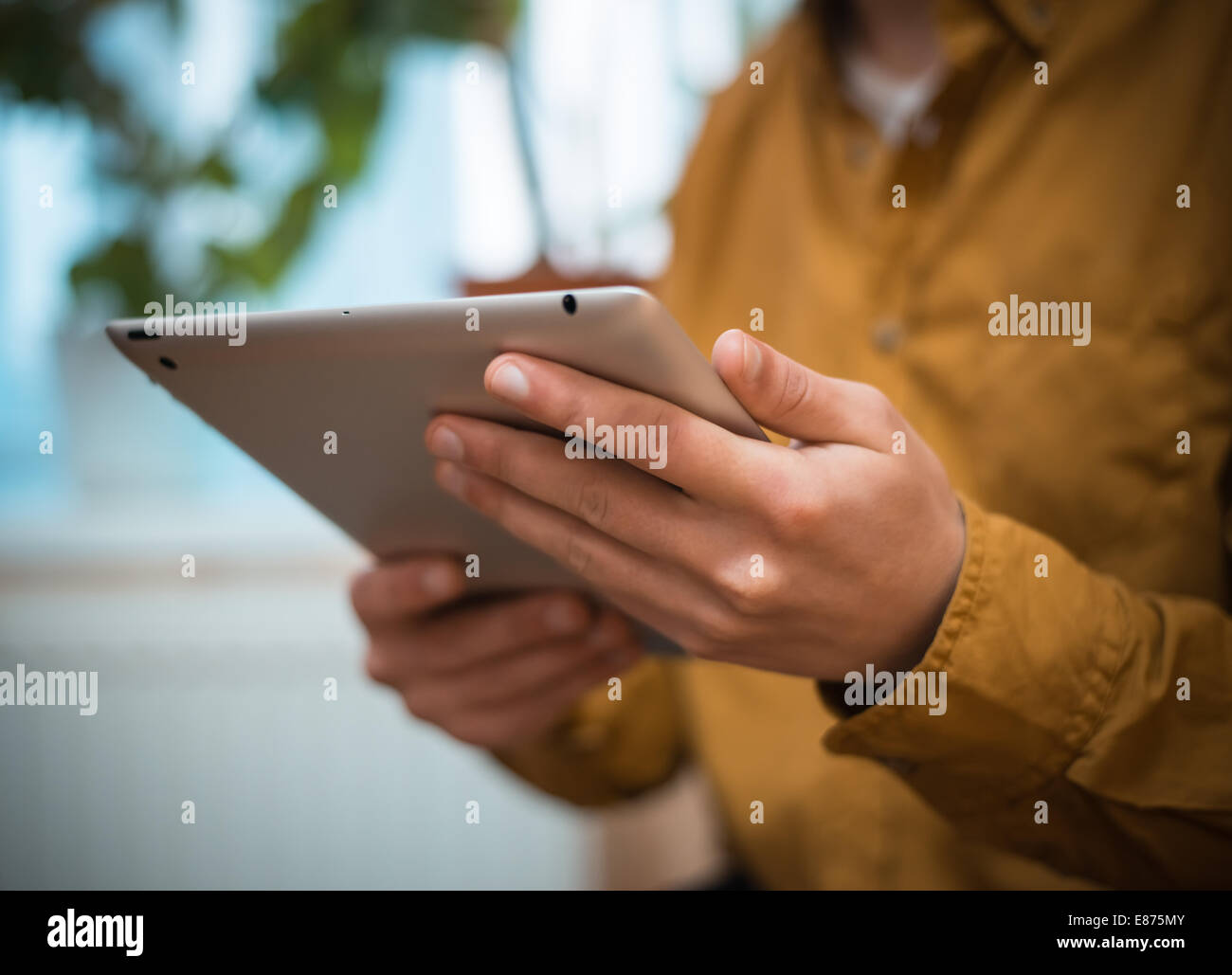 Close up of male hand using digital tablet Stock Photo - Alamy