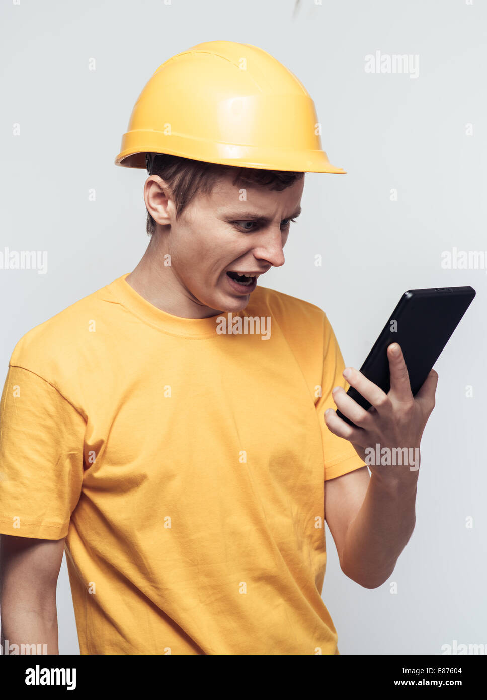 Worker in a helmet hi-res stock photography and images - Alamy