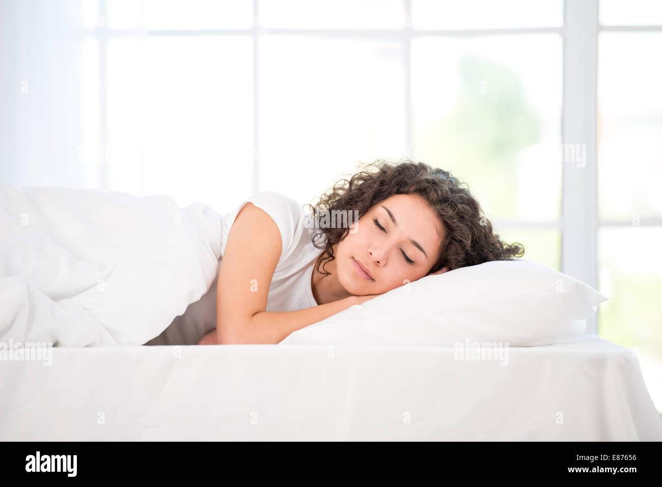 Woman resting head on arm hi-res stock photography and images - Alamy