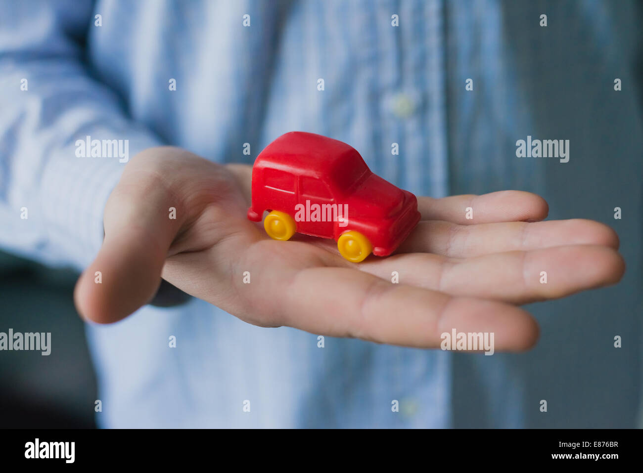 Man holds in his hand cars Stock Photo - Alamy