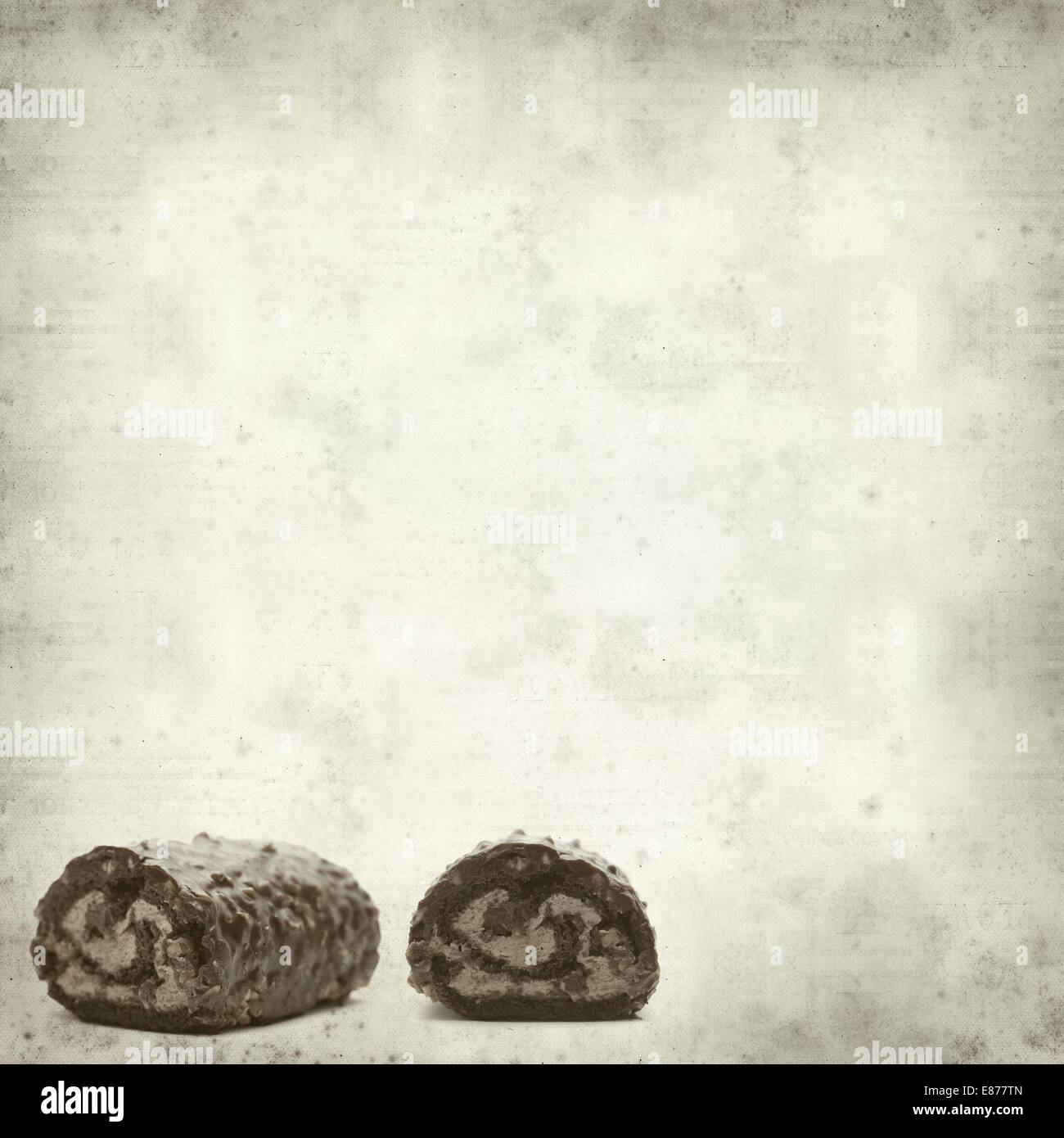 textured old paper background with chocolate roll cake Stock Photo - Alamy