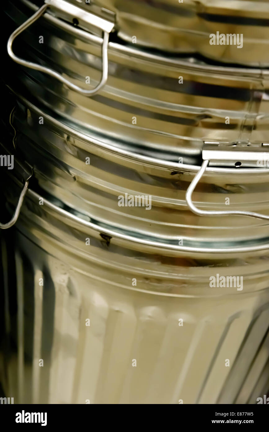 stack of shiny new steel garbage cans Stock Photo - Alamy