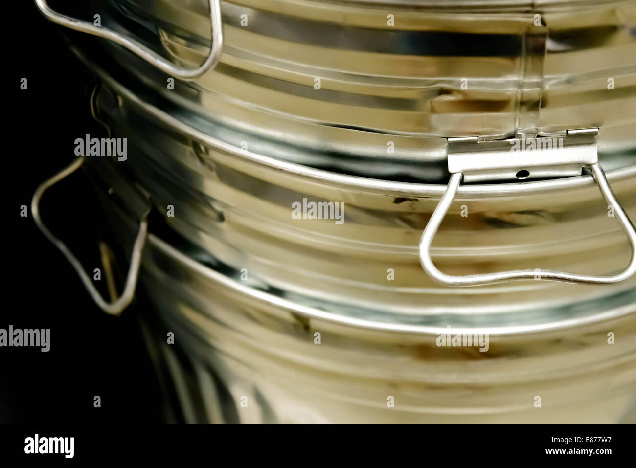 stack of shiny new steel garbage cans Stock Photo - Alamy