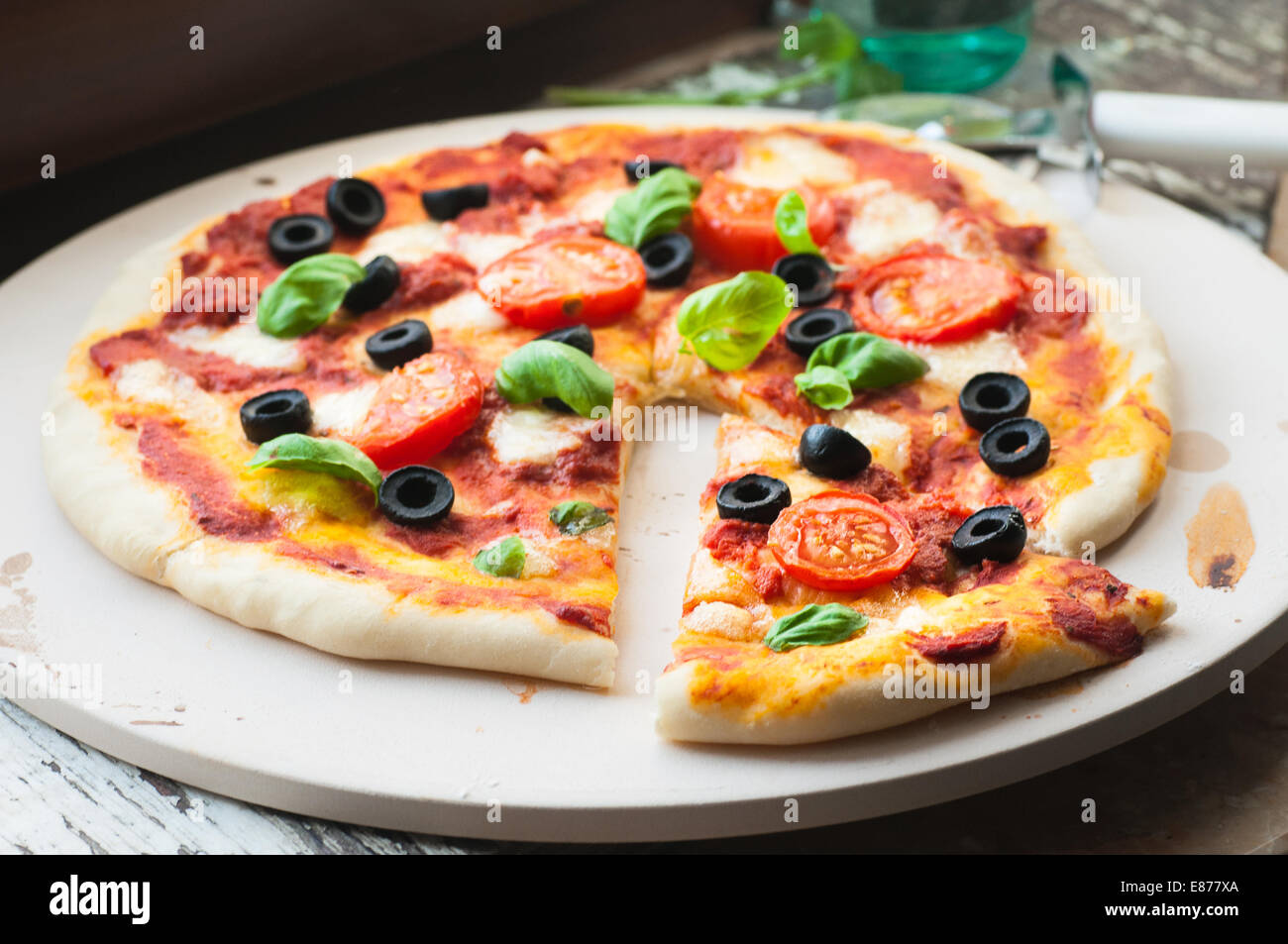 Poznan, Poland, Pizza Margherita with fresh basil, tomatoes and olives ...