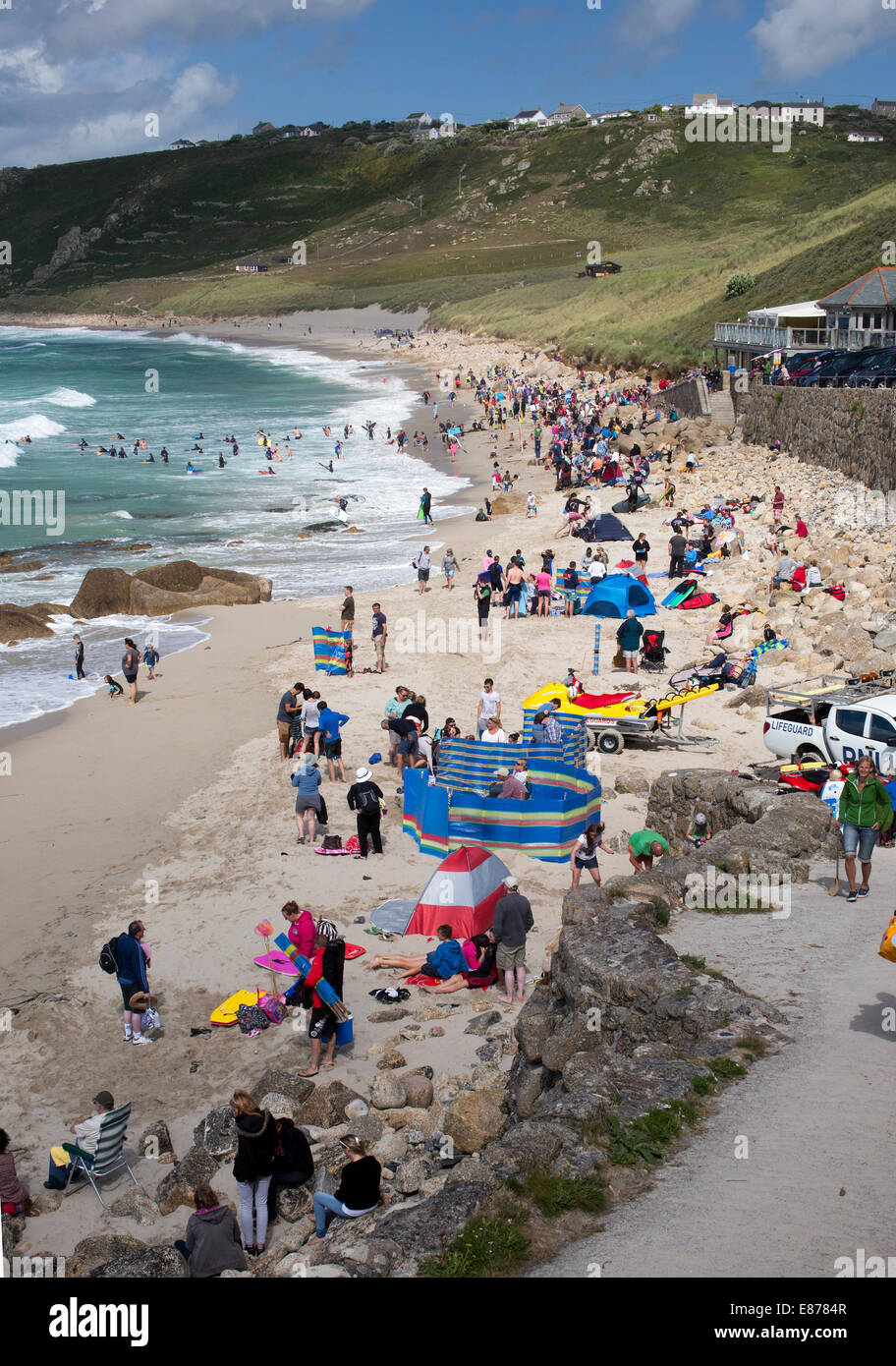 Crowds enjoying the beautiful sandy beach at Sennen Cove, Cornwall ...