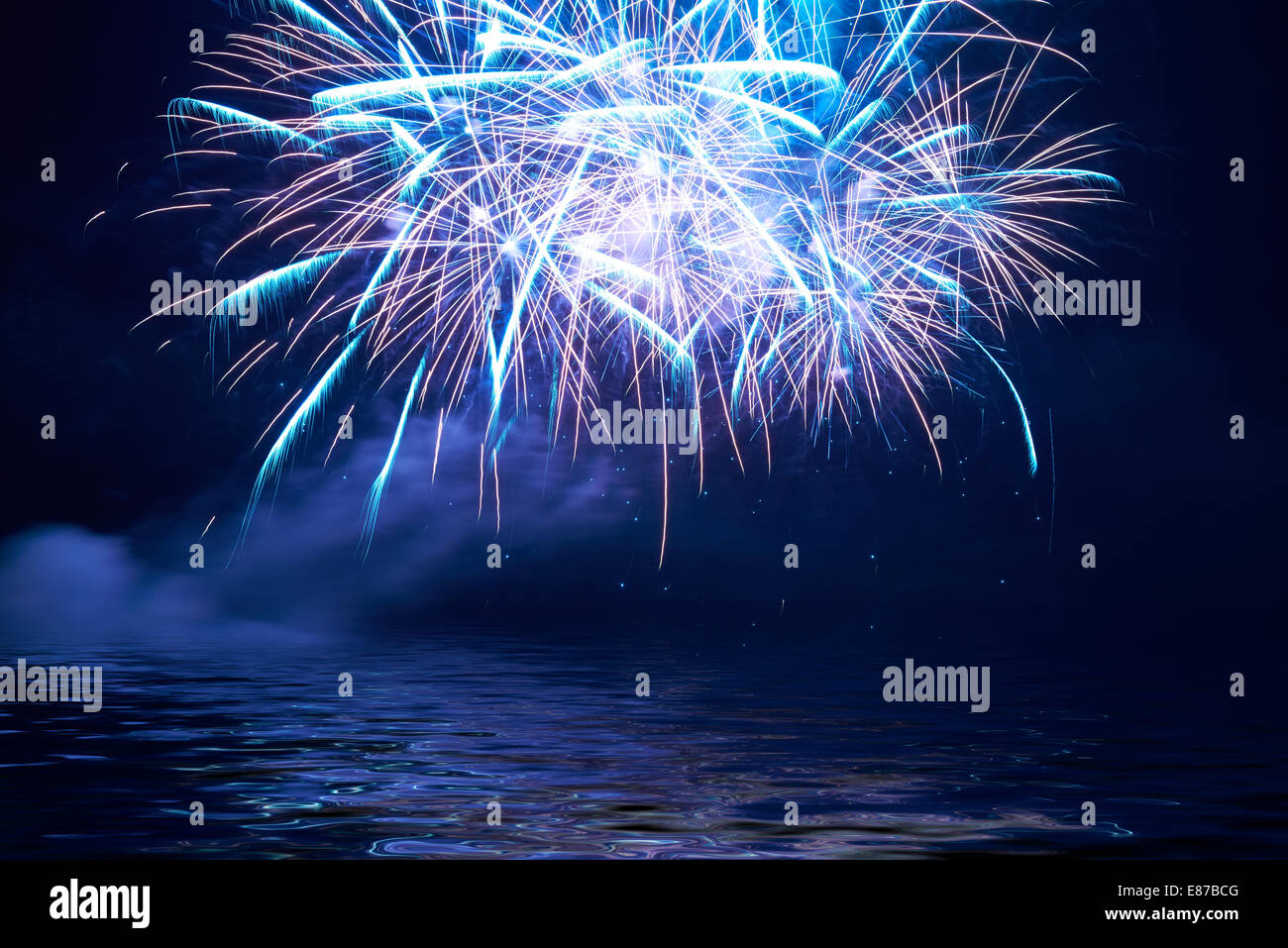 Blue colorful fireworks on the black sky background Stock Photo - Alamy