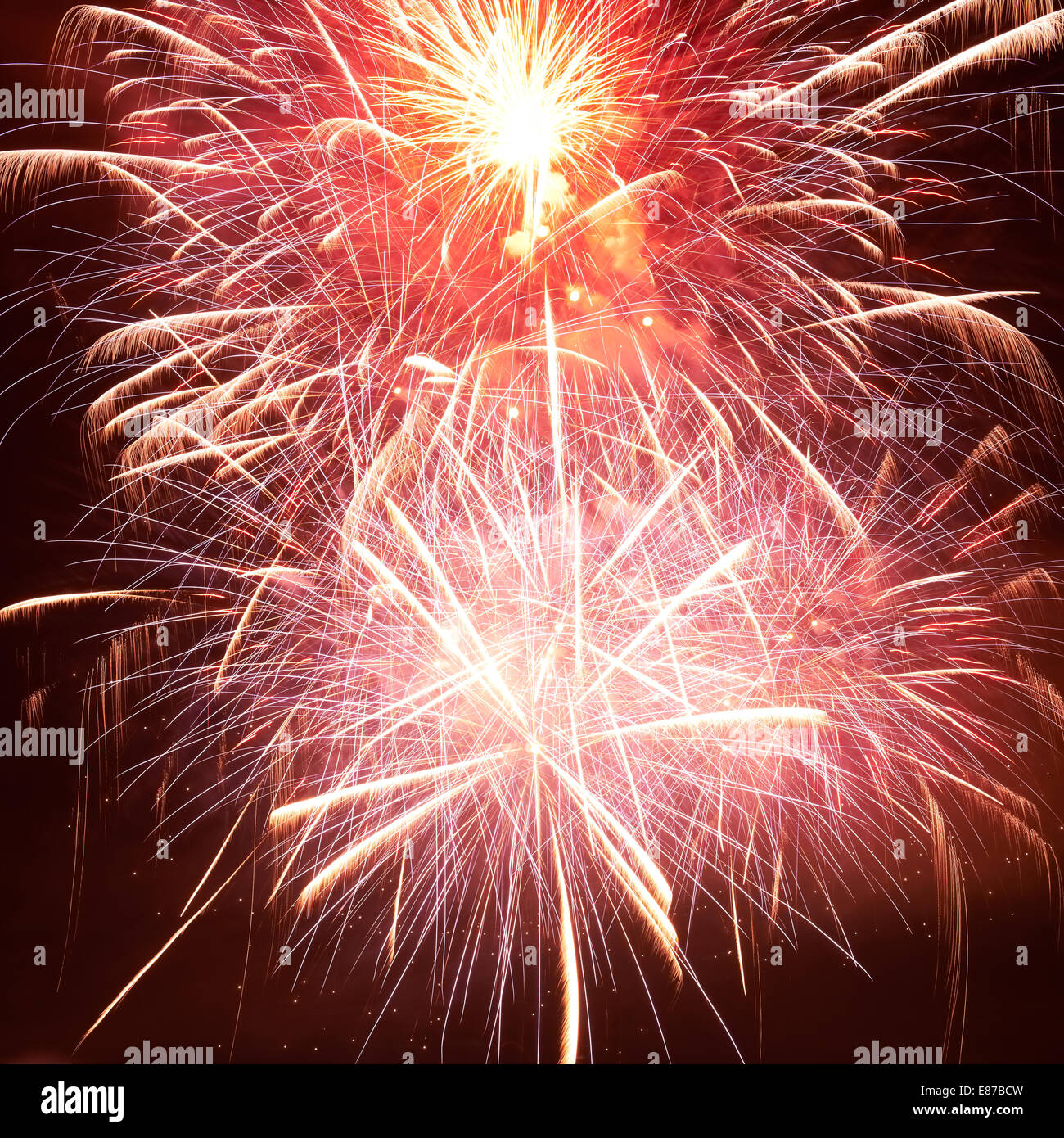 Red colorful fireworks on the black sky background Stock Photo - Alamy
