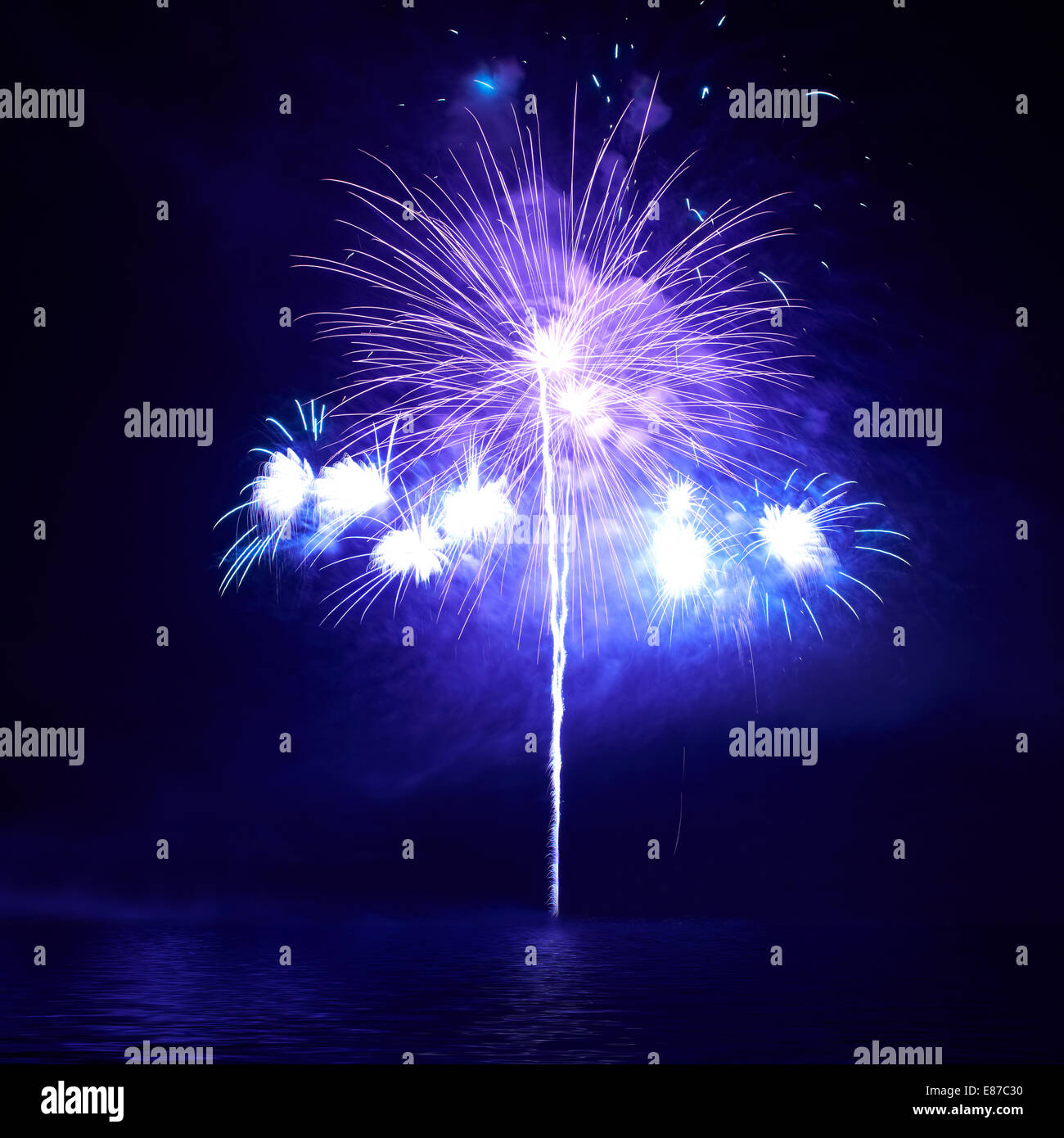 Blue colorful fireworks on the black sky background Stock Photo - Alamy
