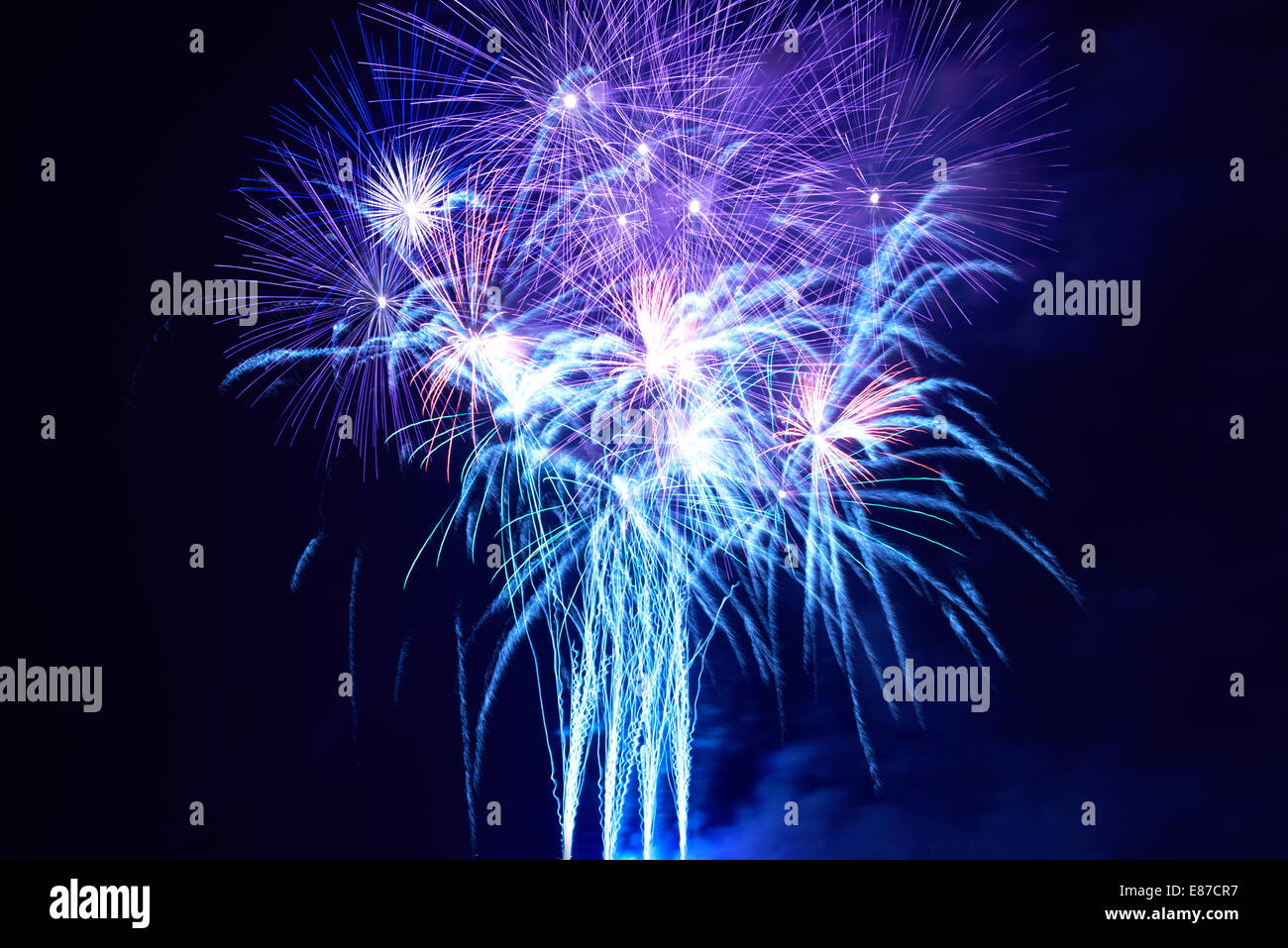 Blue colorful fireworks on the black sky background Stock Photo - Alamy