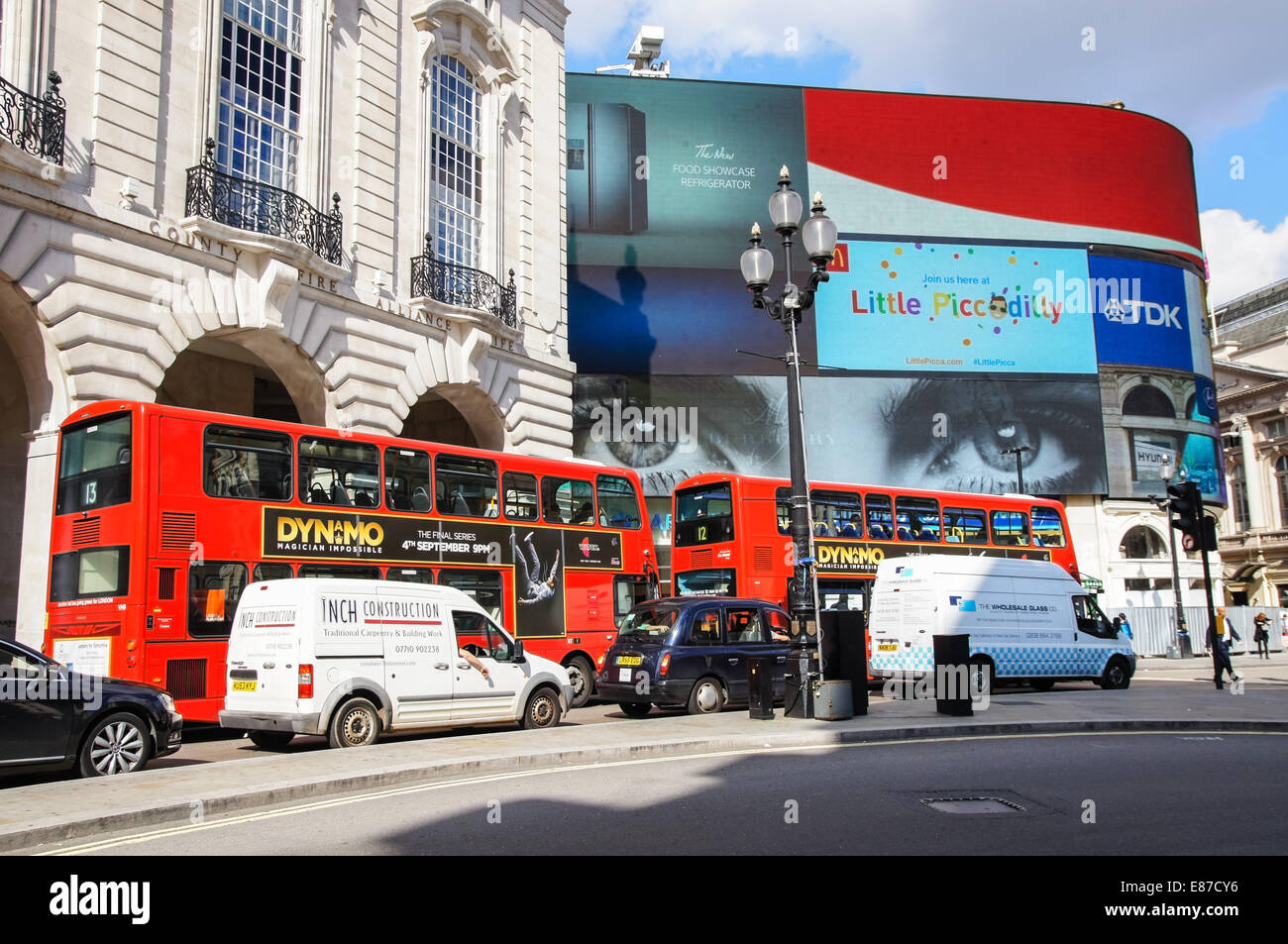 Two red double decker buses on Piccadilly Circus in London England ...