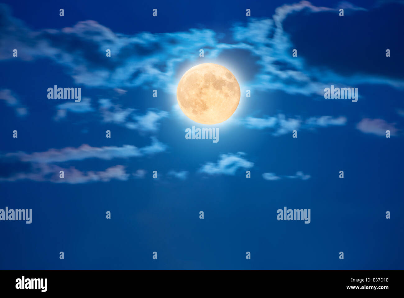 Big shiny moon on the blue sky with clouds Stock Photo - Alamy
