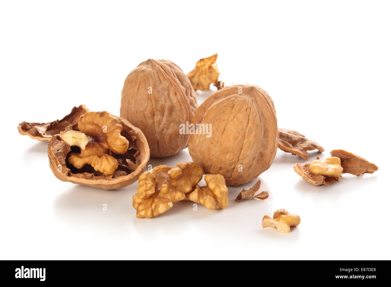 Whole and broken walnuts isolated on white background Stock Photo - Alamy