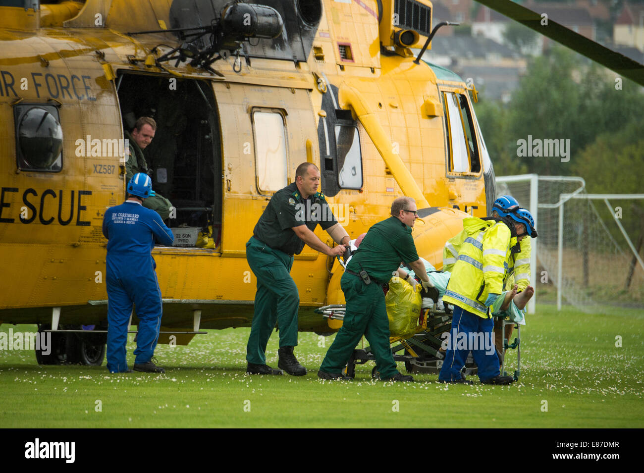 A RAF Air Sea rescue Sea King helicopter and crew transfering a man to ...