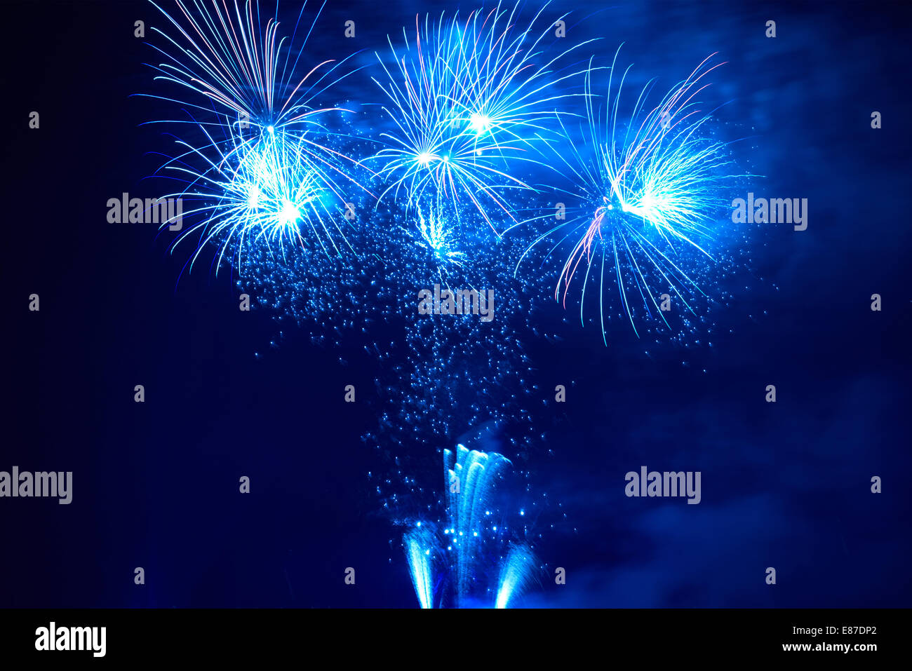 Blue colorful fireworks on the black sky background Stock Photo - Alamy