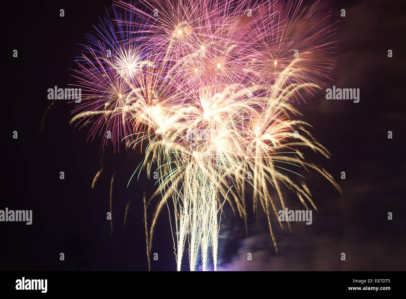 Red colorful fireworks on the black sky background Stock Photo - Alamy