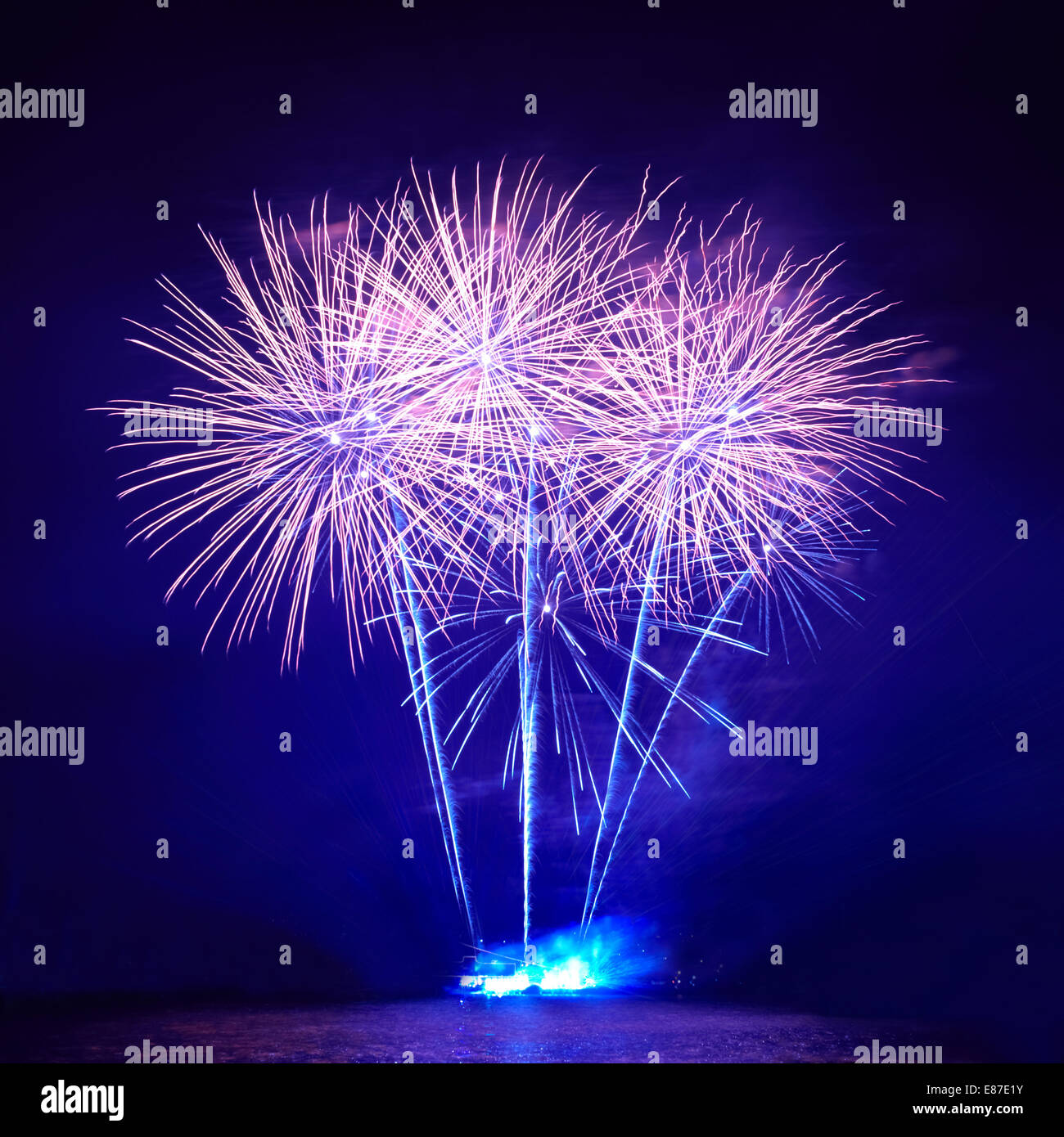 Blue colorful fireworks on the black sky background Stock Photo - Alamy