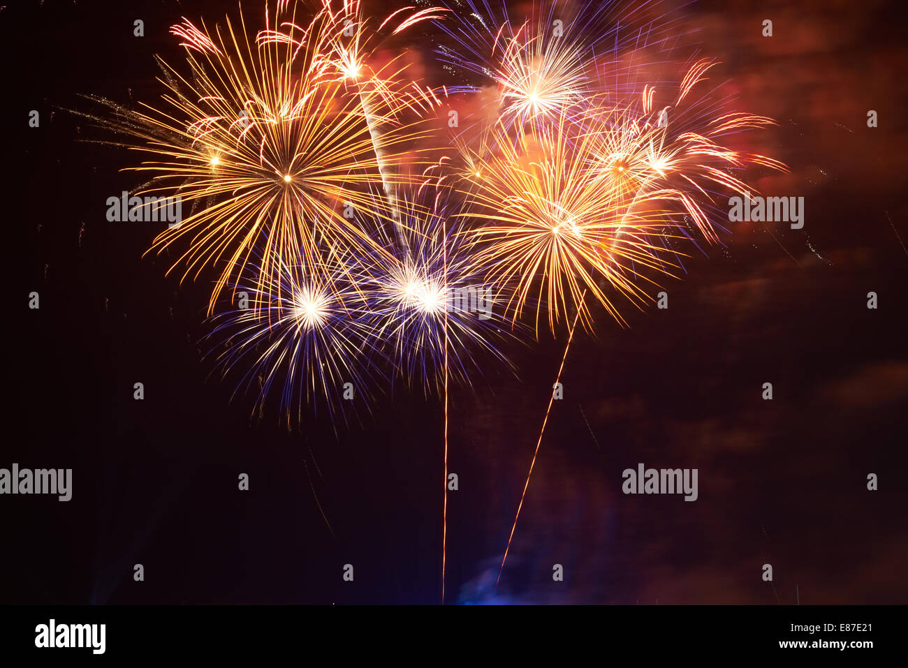 Red colorful fireworks on the black sky background Stock Photo - Alamy