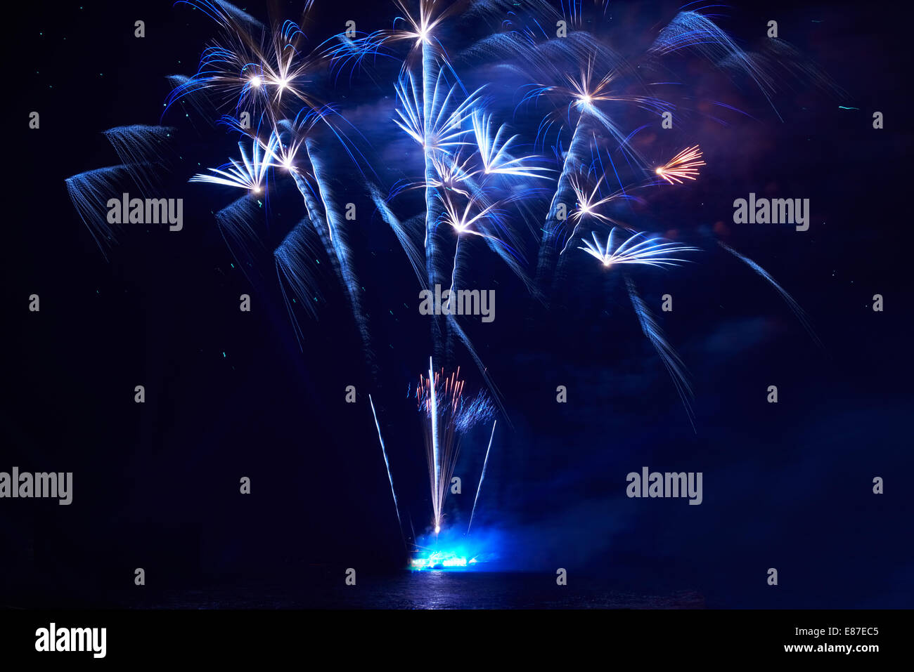 Blue colorful fireworks on the black sky background Stock Photo - Alamy