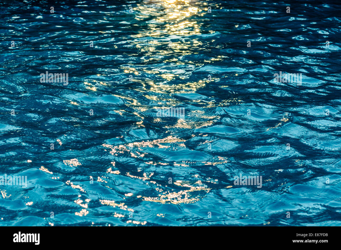 Beautiful surface of blue water reflects sunlight in the evening Stock ...