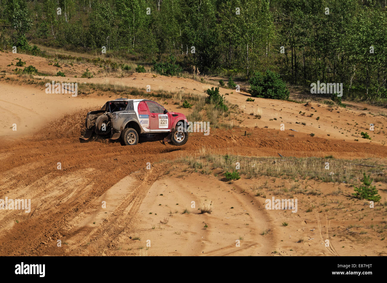 Races on a rally-raid on sandy dunes Stock Photo - Alamy