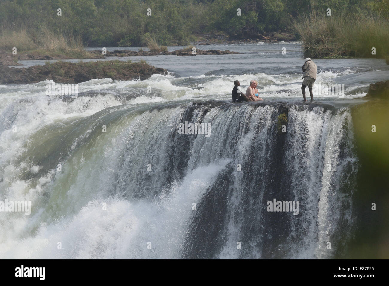Victoria Falls, Zimbabwe. 2nd October, 2014. Foreign tourists pose for ...