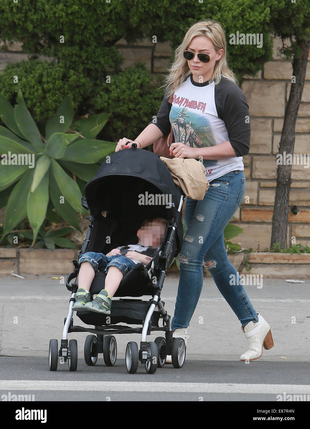 Heavy metal mom Hilary Duff is seen wearing an Iron Maiden raglan shirt ...