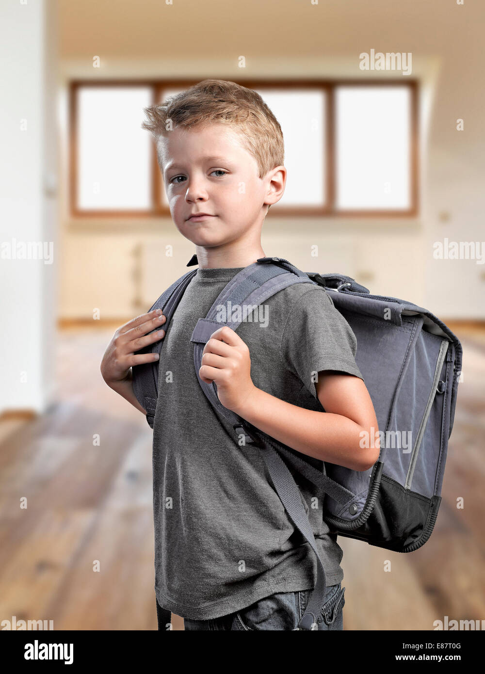 Young boy with backpack isolated on white background ready to go back ...