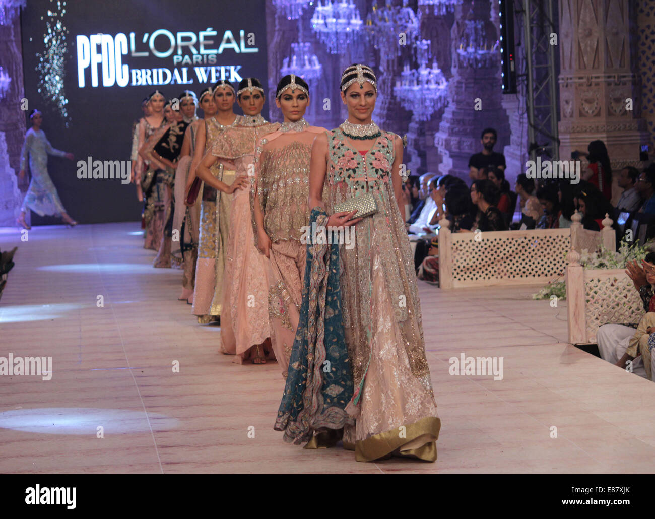 Lahore, Pakistan. 30th Sept, 2014. Models present the creation of ...