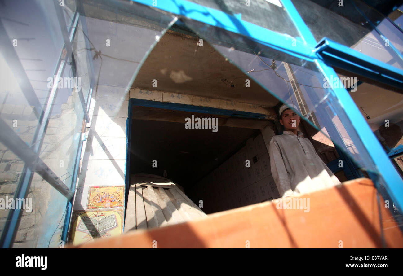 Kabul, Afghanistan. 2nd Oct, 2014. An Afghan baker stands inside his ...