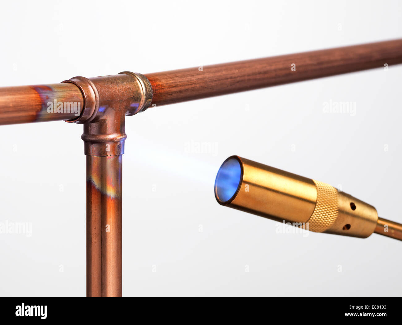 Copper pipe isolated on white Stock Photo - Alamy