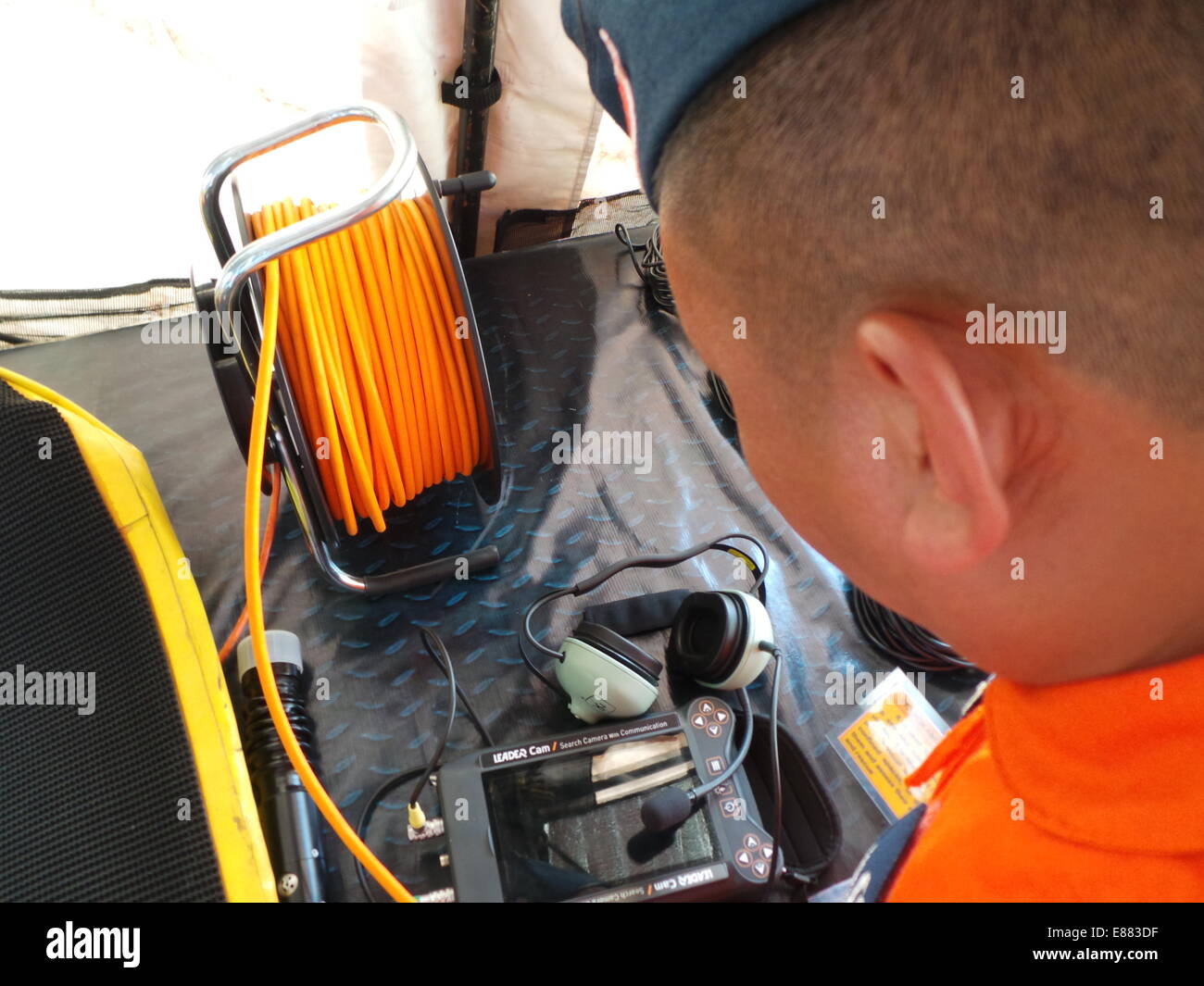 A Philippine Air Force personnel checking life detector equipment that ...