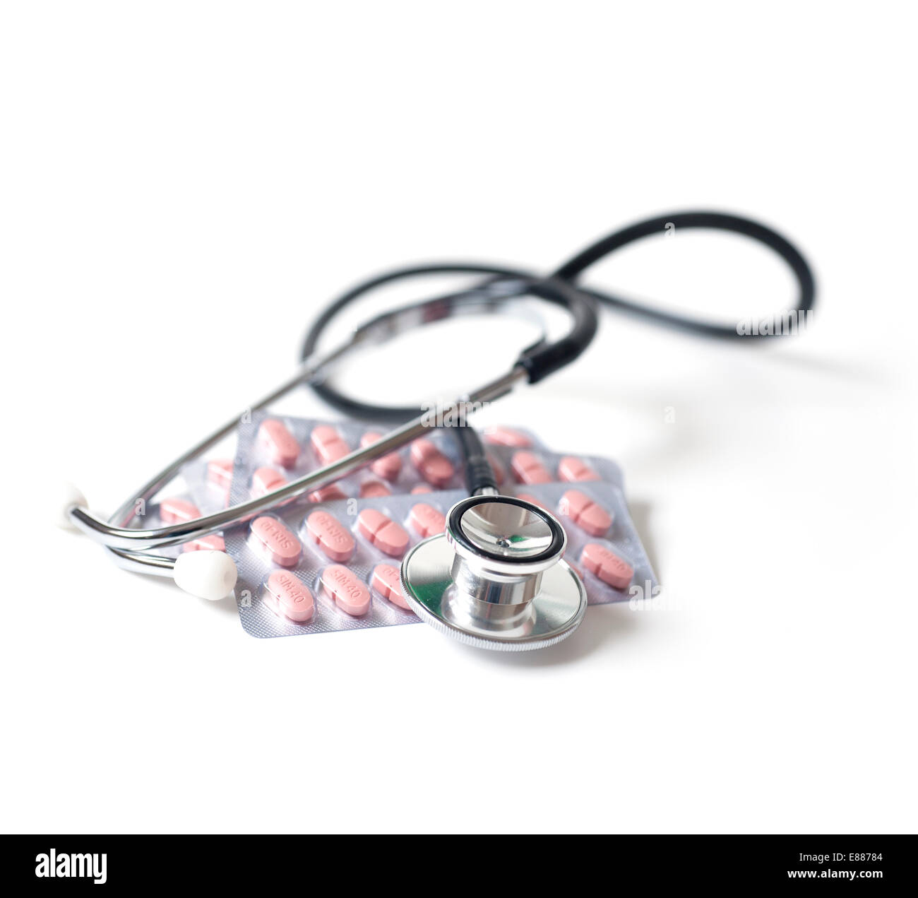 Packs of Statins tablets on a white background with stethoscope Stock ...