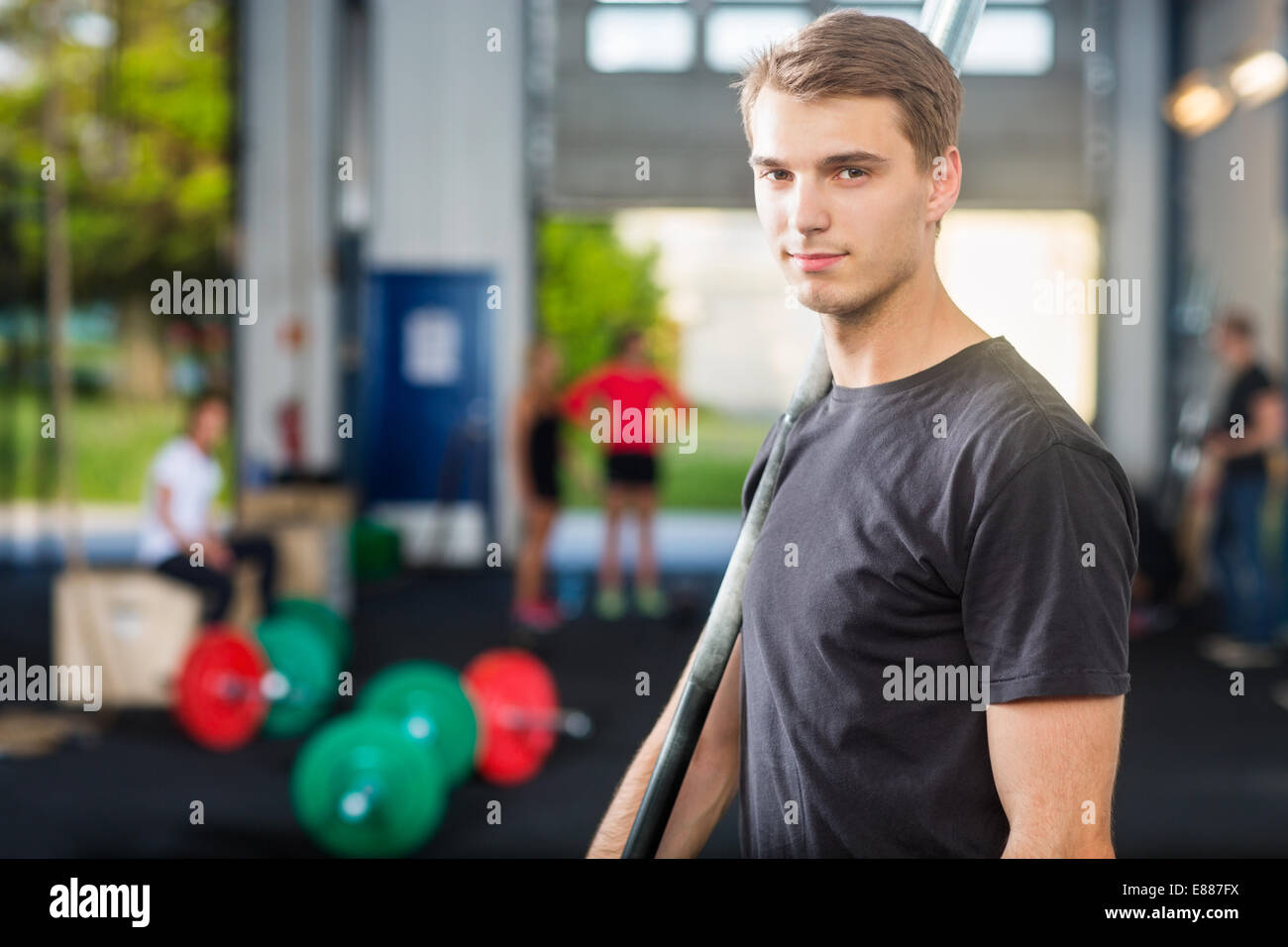 Holding exercise bar hi-res stock photography and images - Alamy