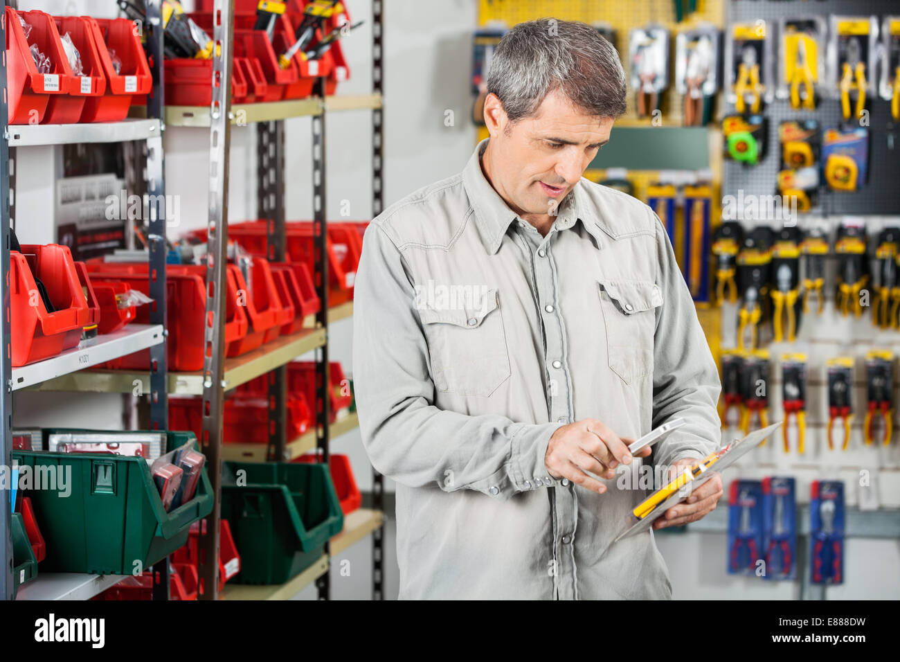 Customer Scanning Tool Packet Through Smartphone Stock Photo - Alamy