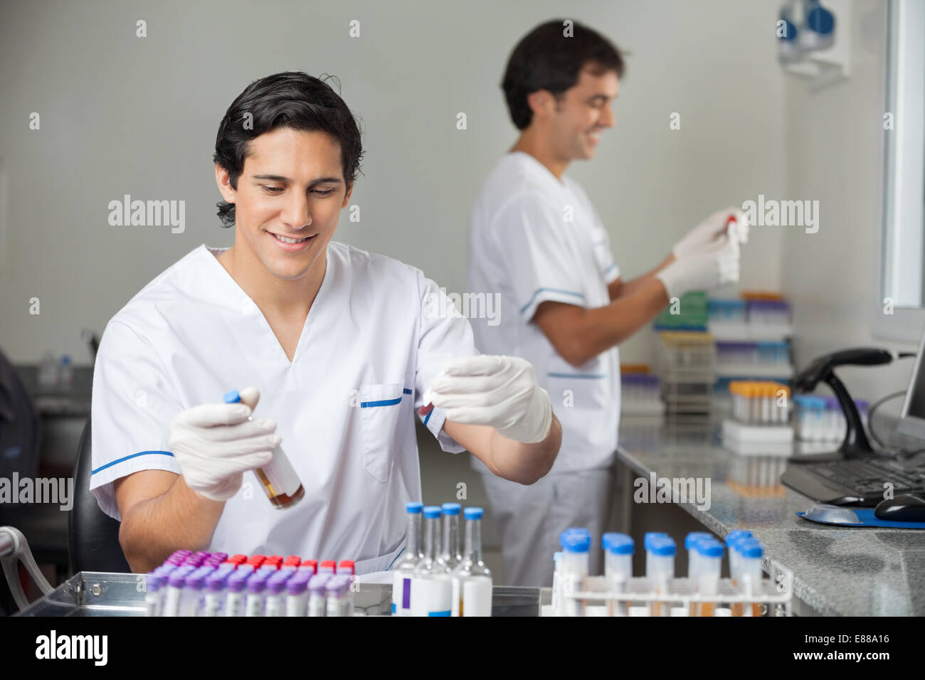 Researchers Analyzing Samples In Laboratory Stock Photo - Alamy